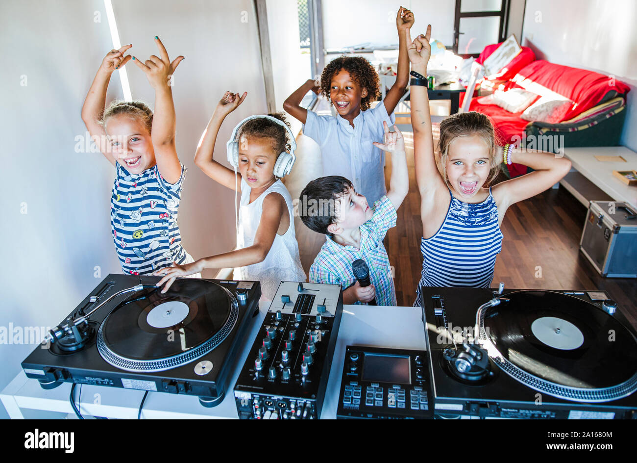 Young friends having a party at the turntable Stock Photo - Alamy