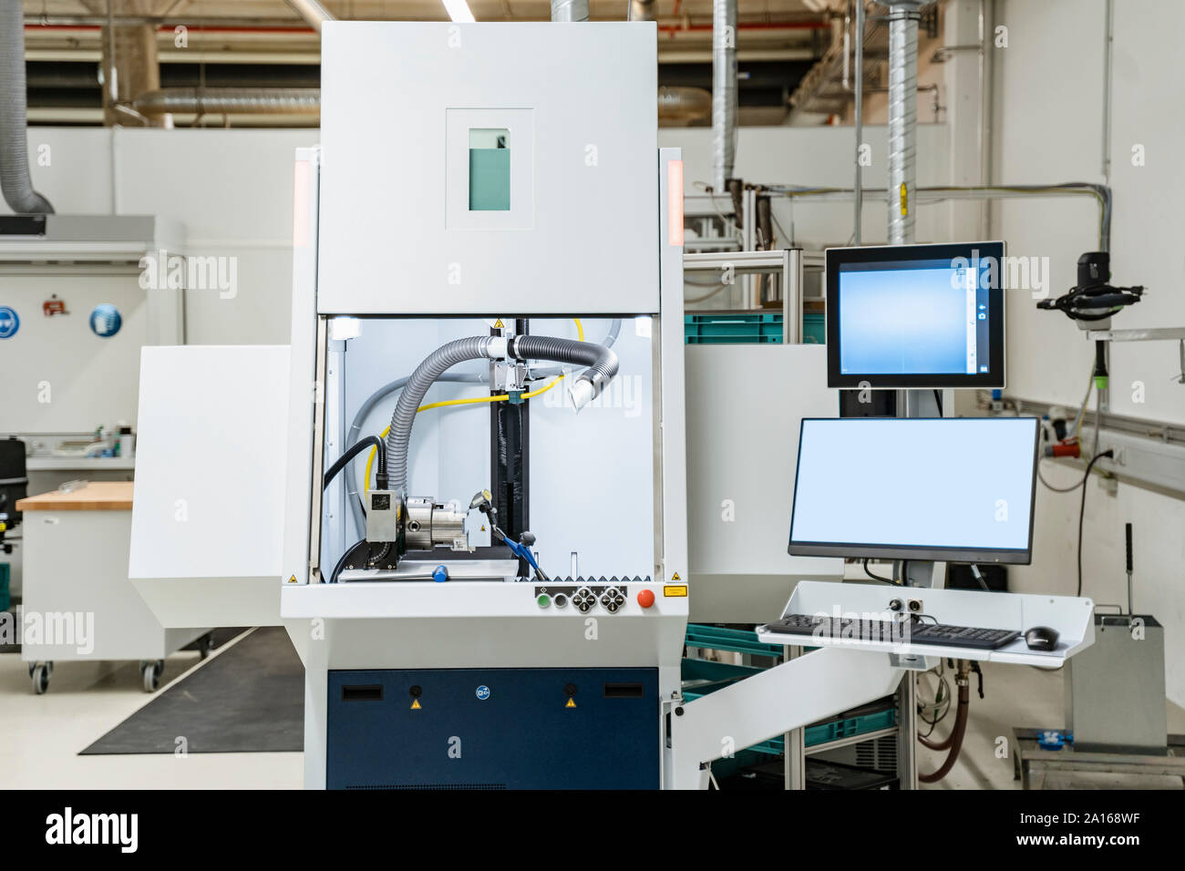 Control station of laser marking system inside modern factory hi-res ...