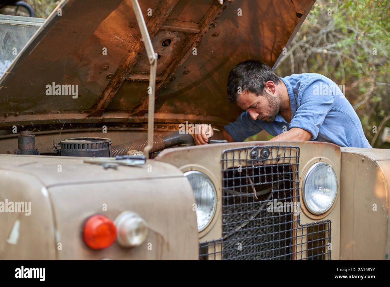 Man with old car having a breakdown Stock Photo - Alamy