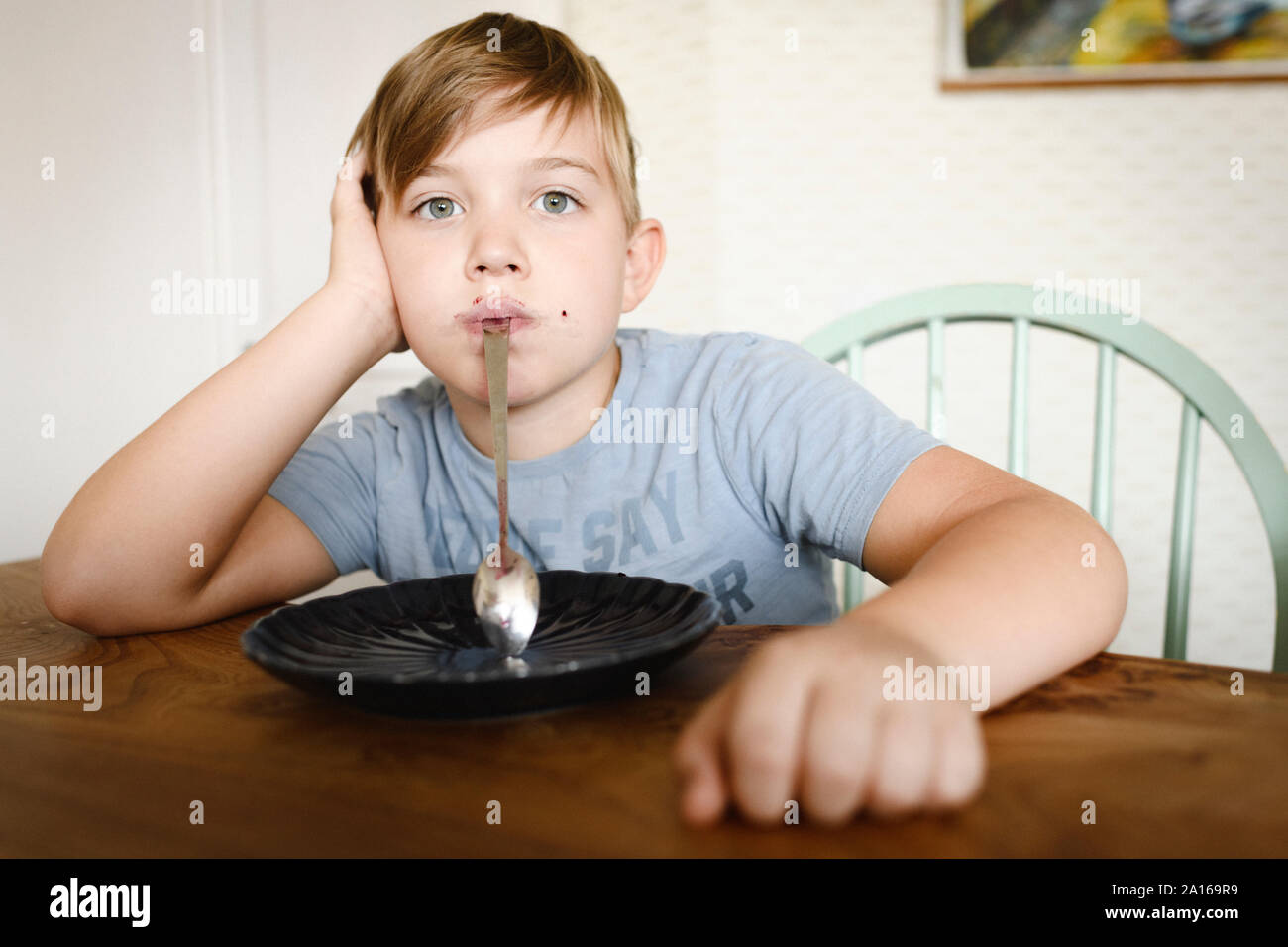 Portrait of a boy with blueberry jam in his face Stock Photo - Alamy