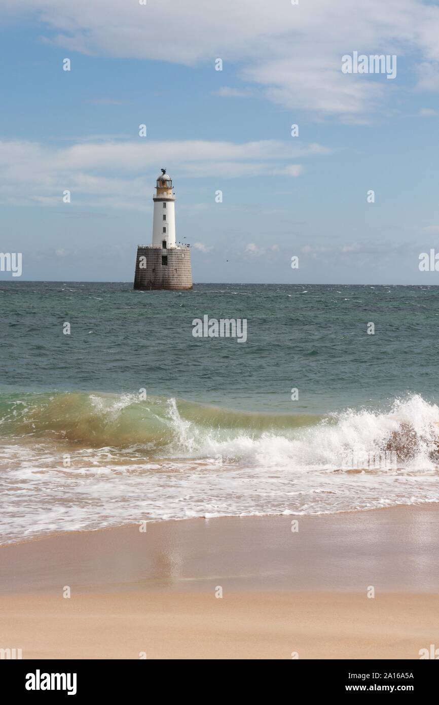 White lighthouse on platform in sea Stock Photo - Alamy