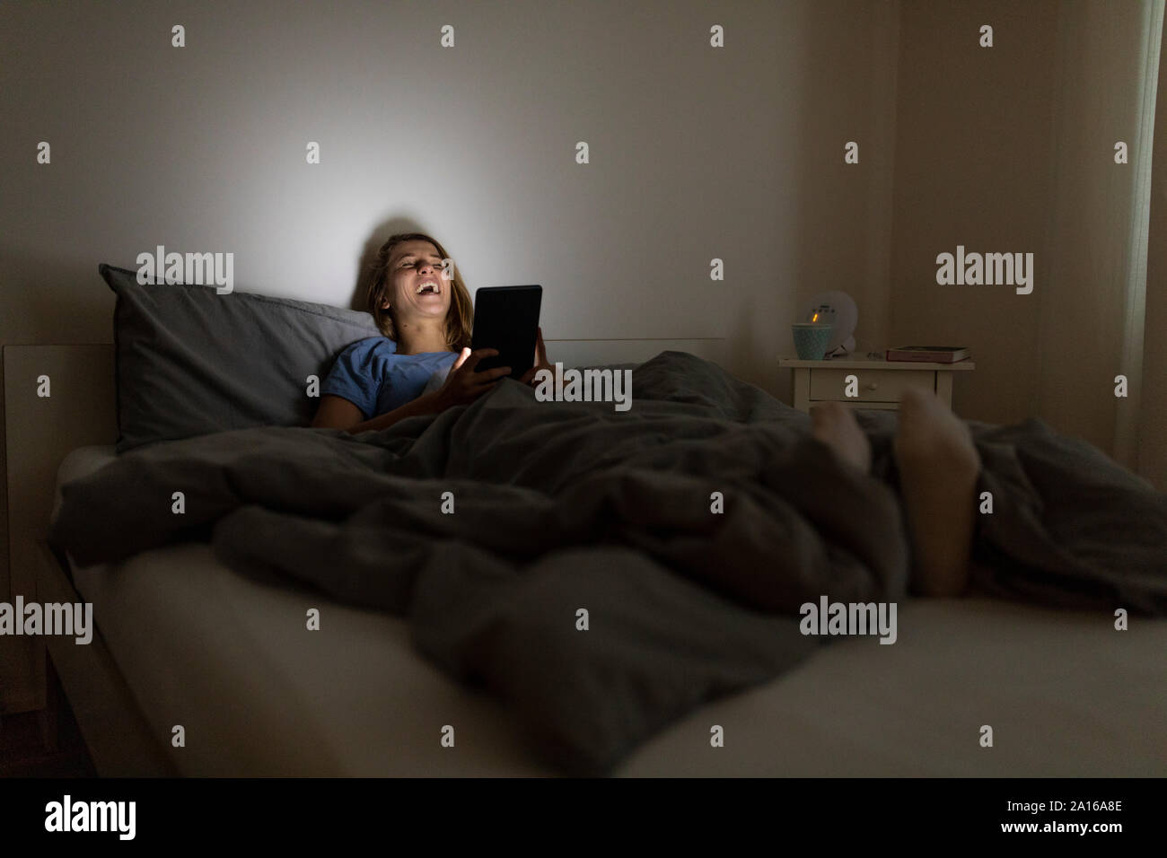 Woman computer night bed hi-res stock photography and images - Alamy