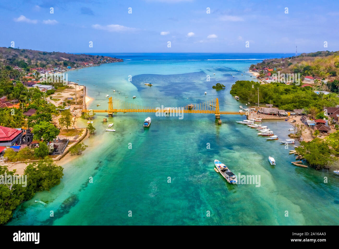 Aerial view of Yellow bridge between the islands of Nusa Cheningan and ...