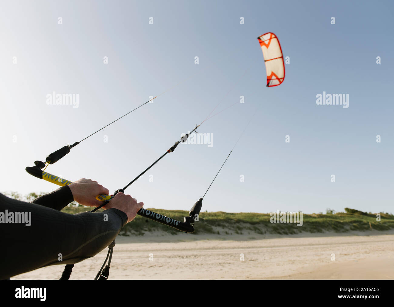 Arms of kiteboarder holding the kite Stock Photo - Alamy