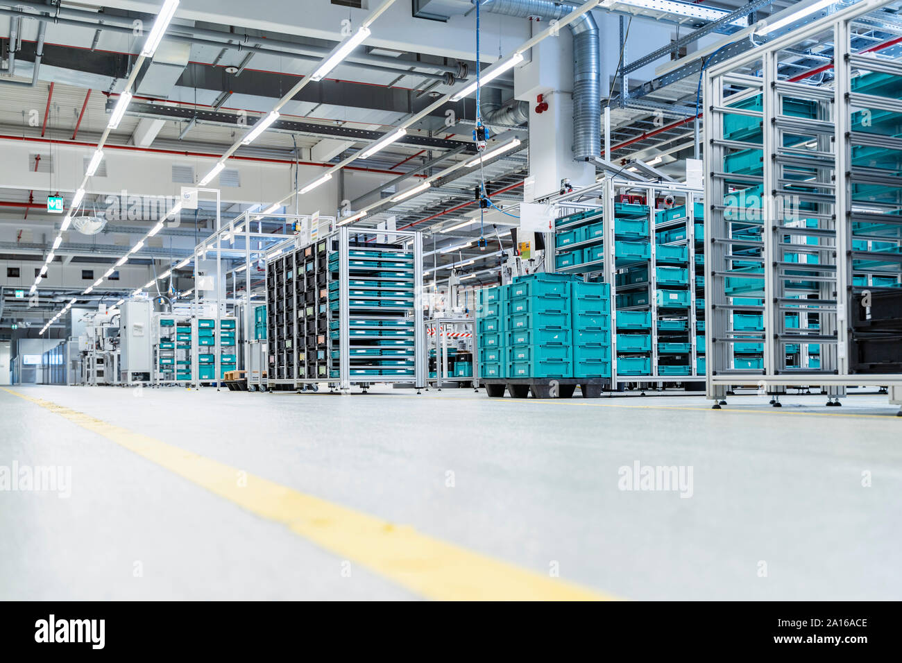 Stacked containers inside modern factory warehouse, Stuttgart, Germany ...