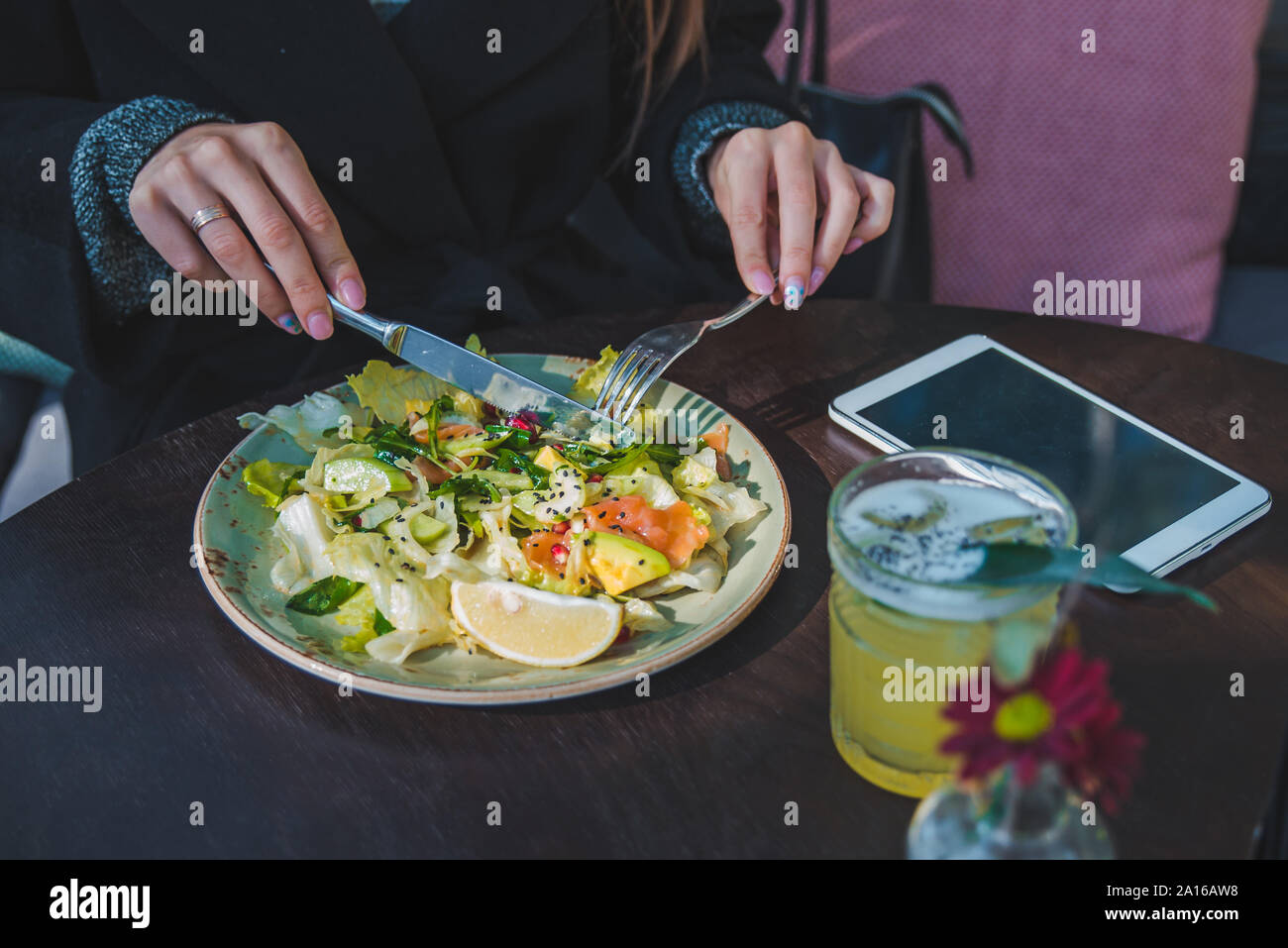 woman in cafe eating salad hands close up no face Stock Photo - Alamy