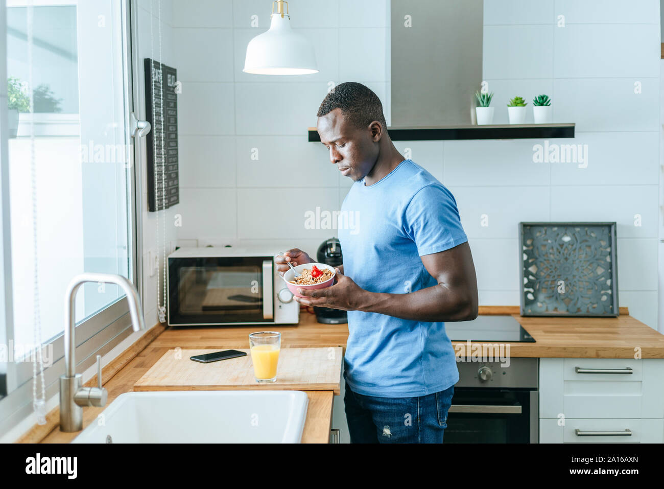 African man eating breakfast hi-res stock photography and images - Alamy