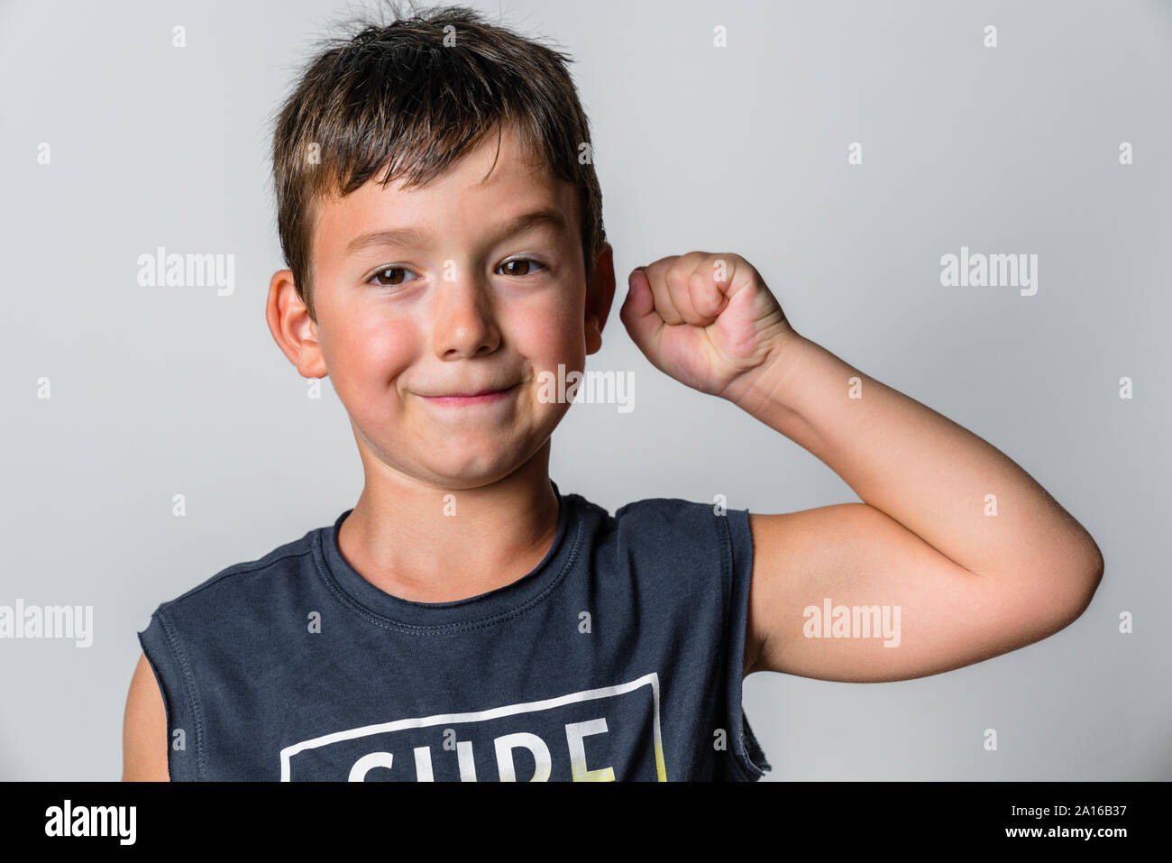 Portrait of strong boy, white background Stock Photo - Alamy