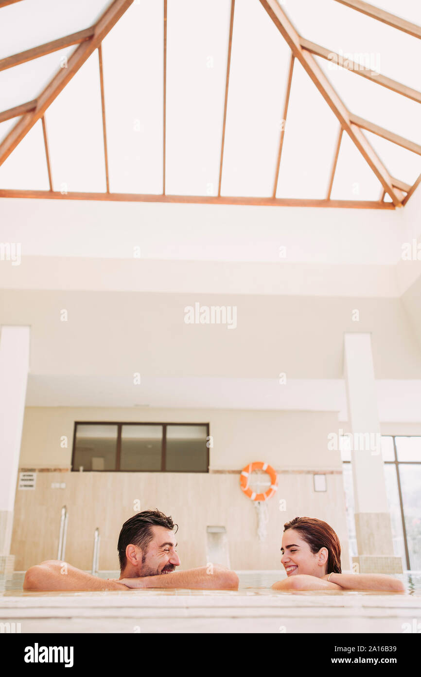 Happy couple relaxing in a spa Stock Photo - Alamy