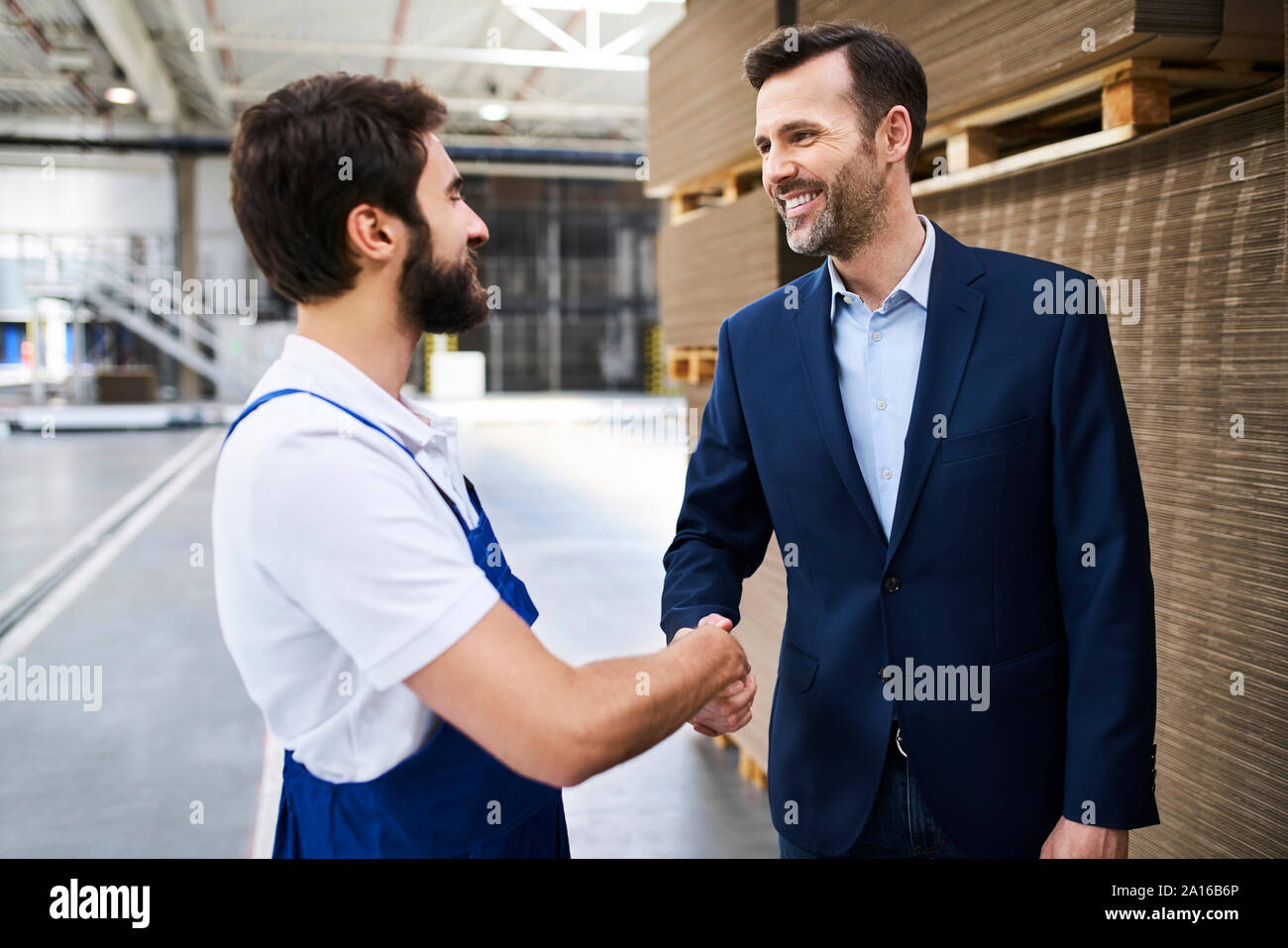 Employee shaking hands with boss hi-res stock photography and images ...