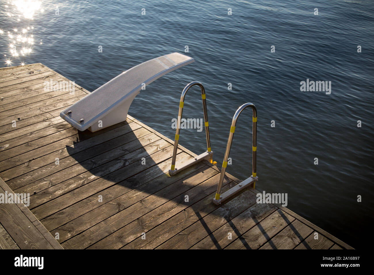 Diving board and step to water on wooden pier in Oslo Stock Photo - Alamy