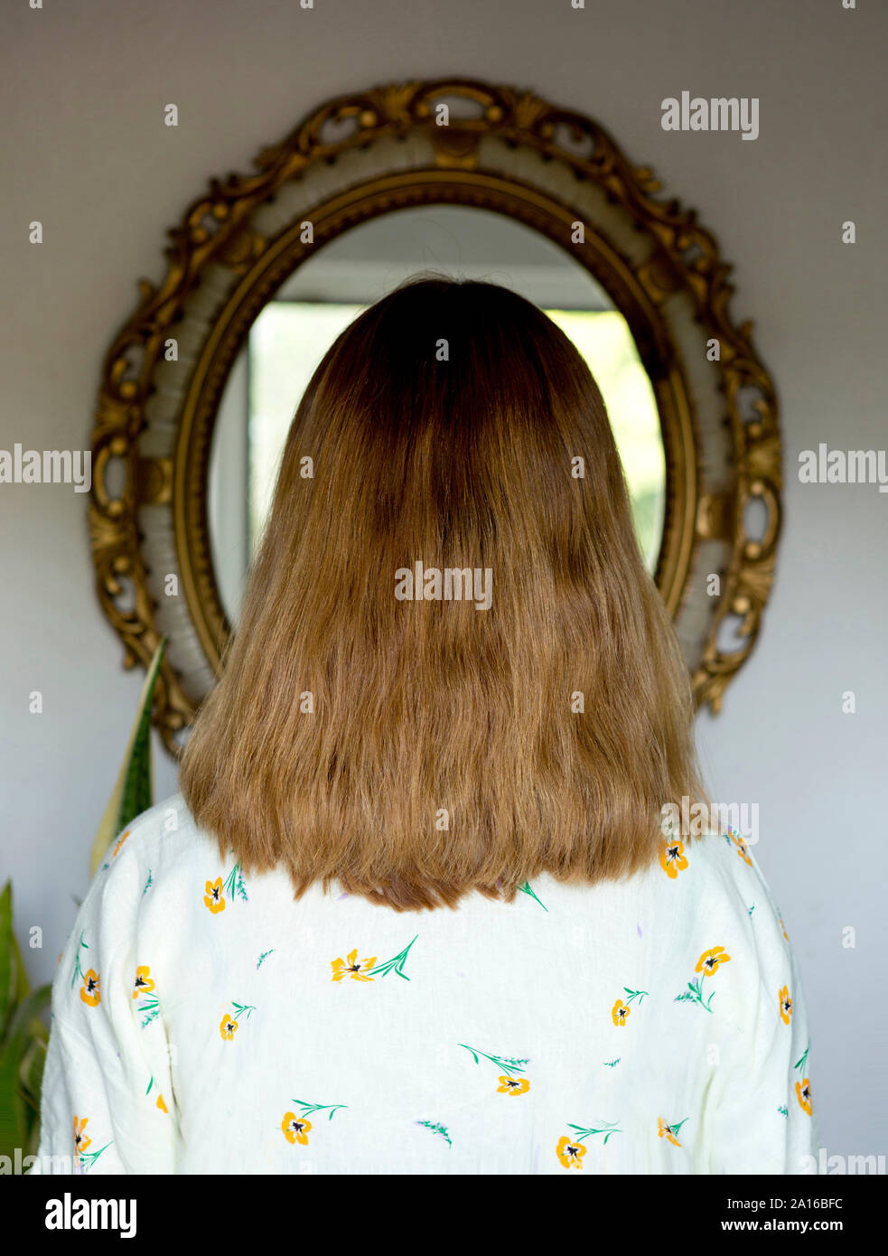 Woman standing in front mirror hi-res stock photography and images - Alamy
