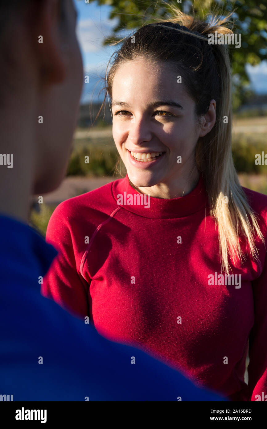 Young woman talking together, face to face Stock Photo - Alamy
