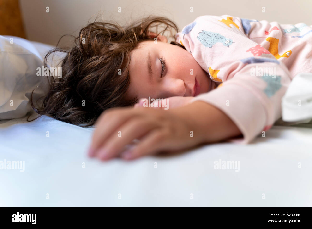 Cute little girl sleeping in bed Stock Photo - Alamy