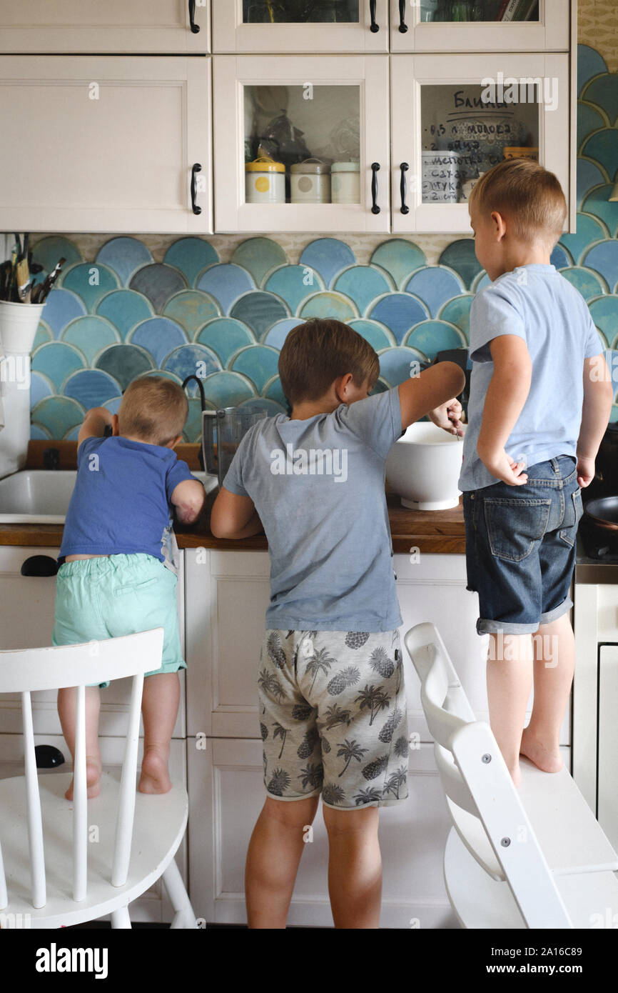 Siblings Cooking In Kitchen High Resolution Stock Photography and ...