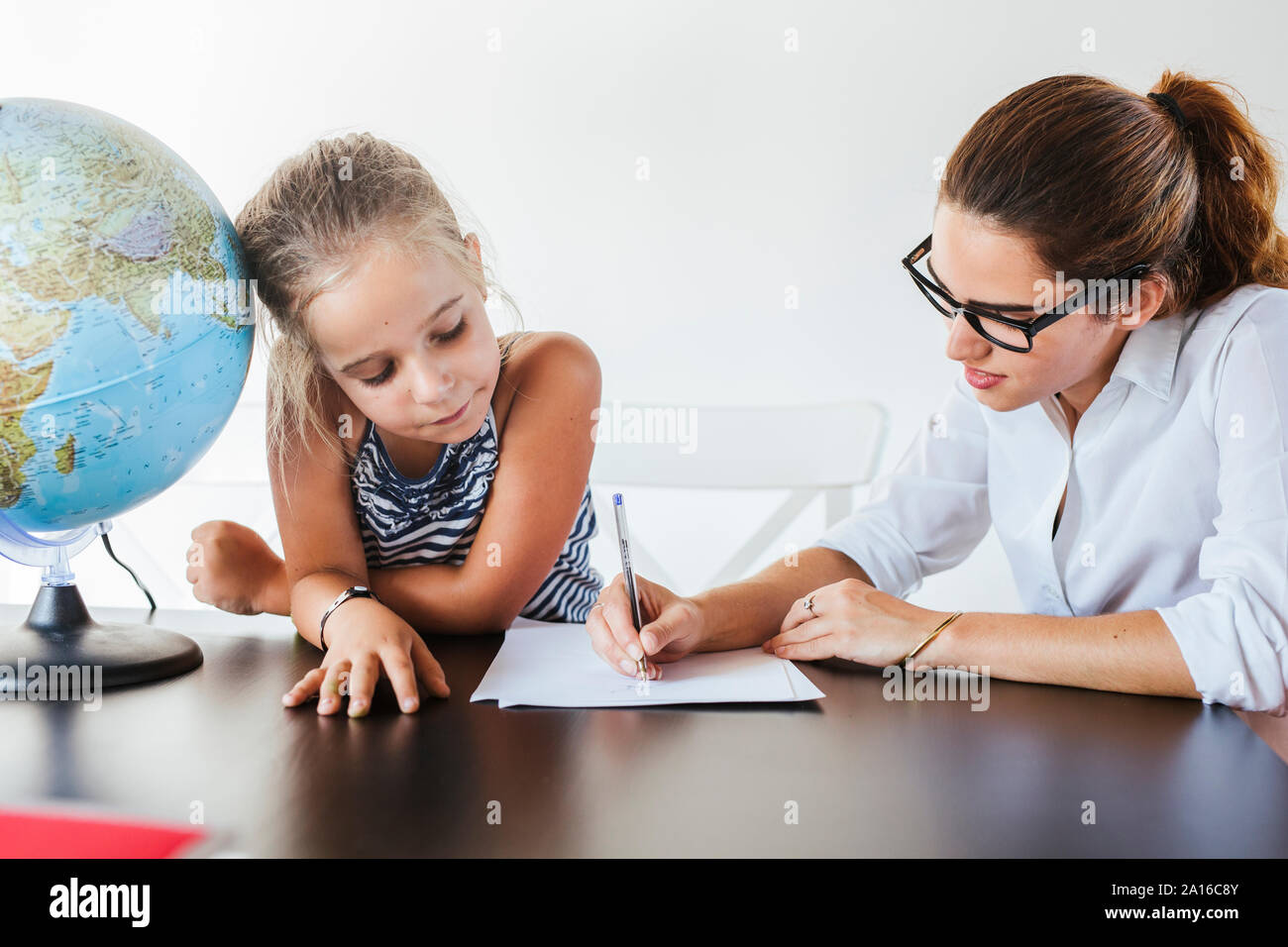 Student writing paper desk hi-res stock photography and images - Alamy