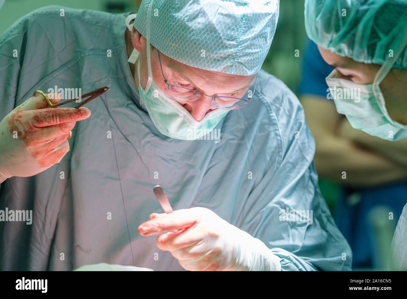 Surgeon during surgery Stock Photo - Alamy