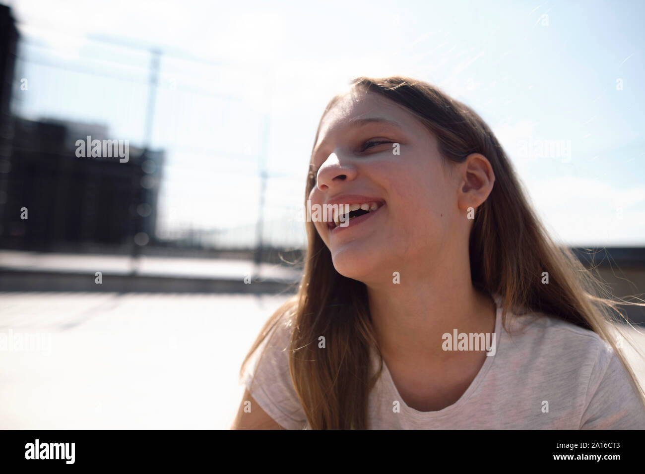Portrait of happy girl outdoors Stock Photo - Alamy