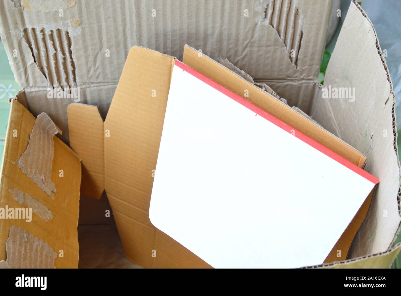 scrap hard paper for recycle in brown box Stock Photo - Alamy