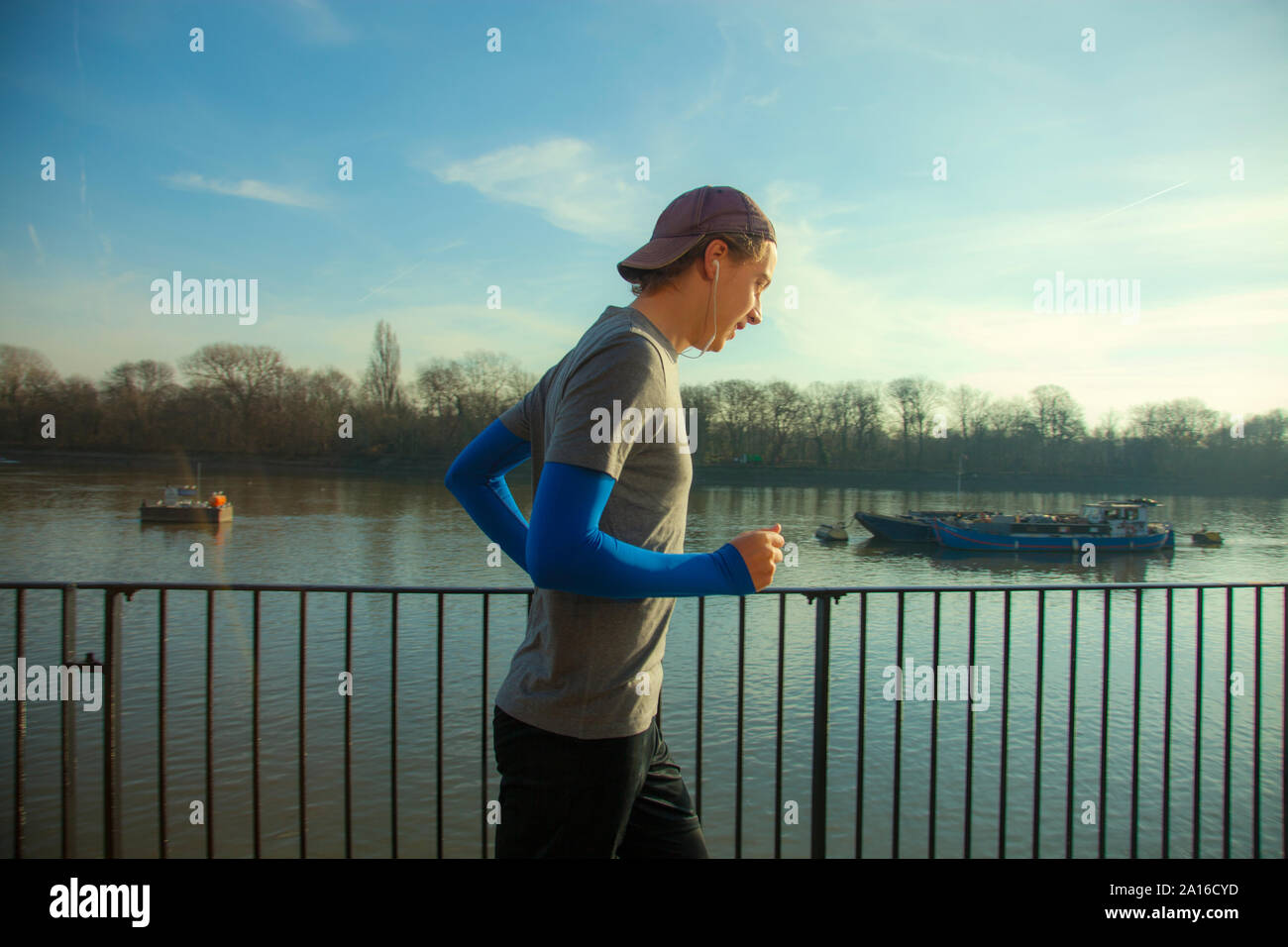 Young man jogging along River Thames, London, UK Stock Photo - Alamy