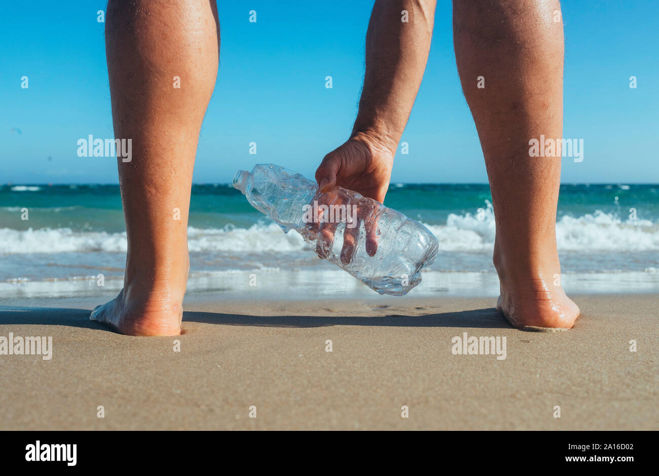 Hand picking up plastic bottle hi-res stock photography and images - Alamy