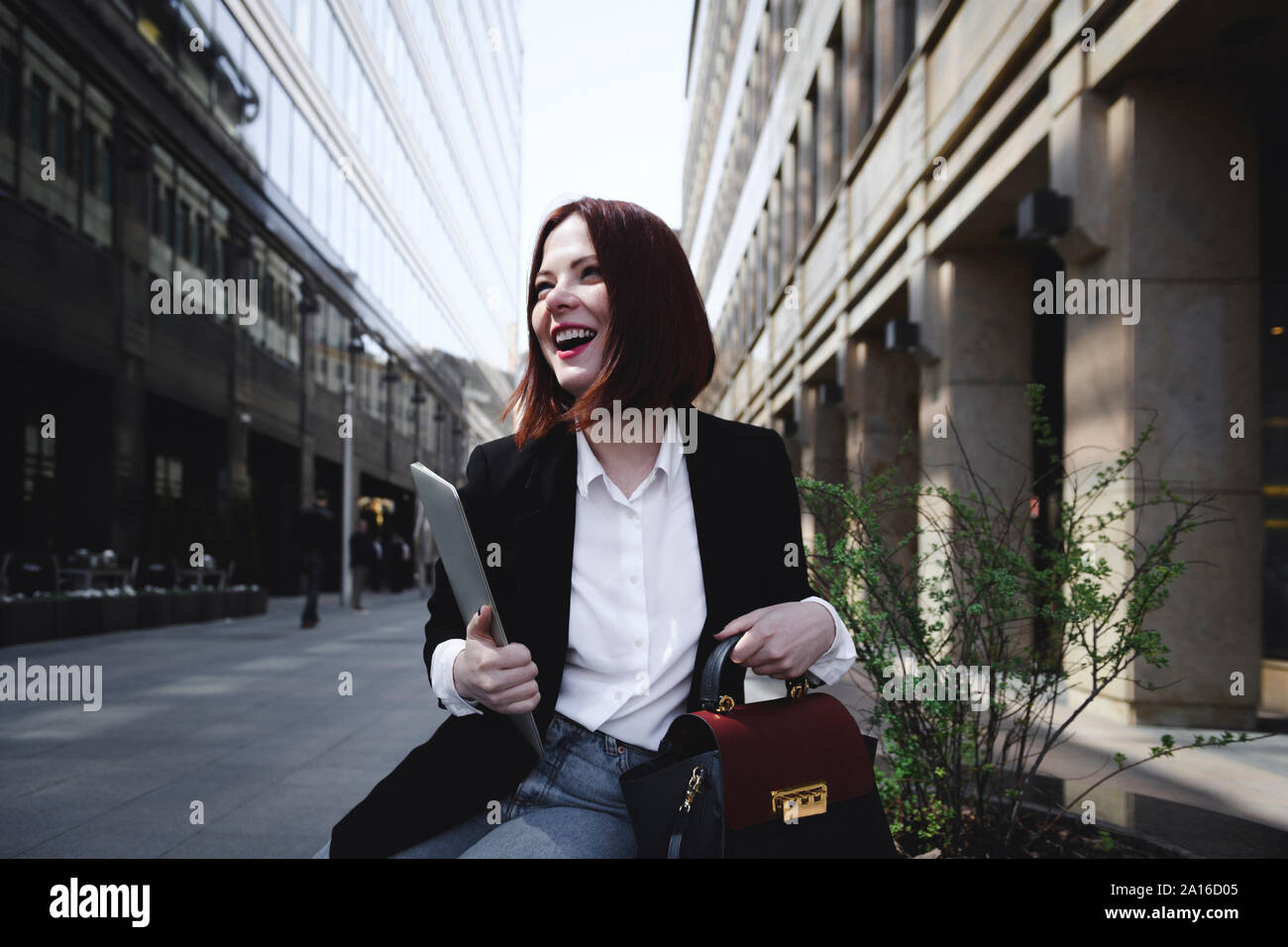 Woman carrying laptop bag hi-res stock photography and images - Alamy