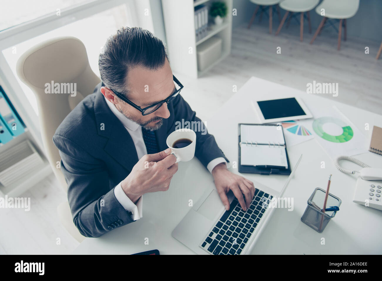 High angle above top view man in formalwear using pc gadget sit Stock ...