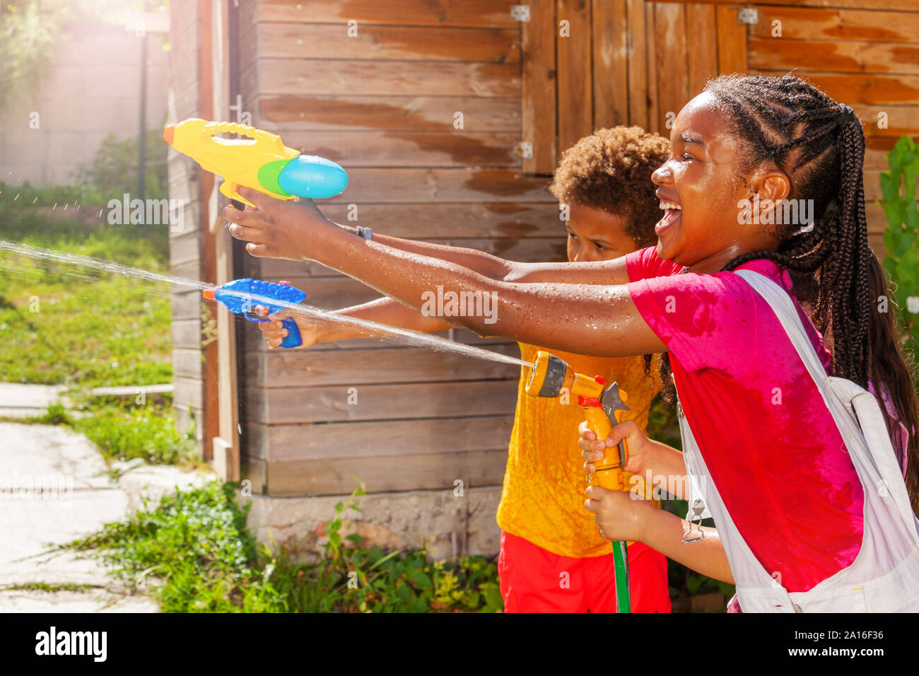 Watergun fight hi-res stock photography and images - Alamy