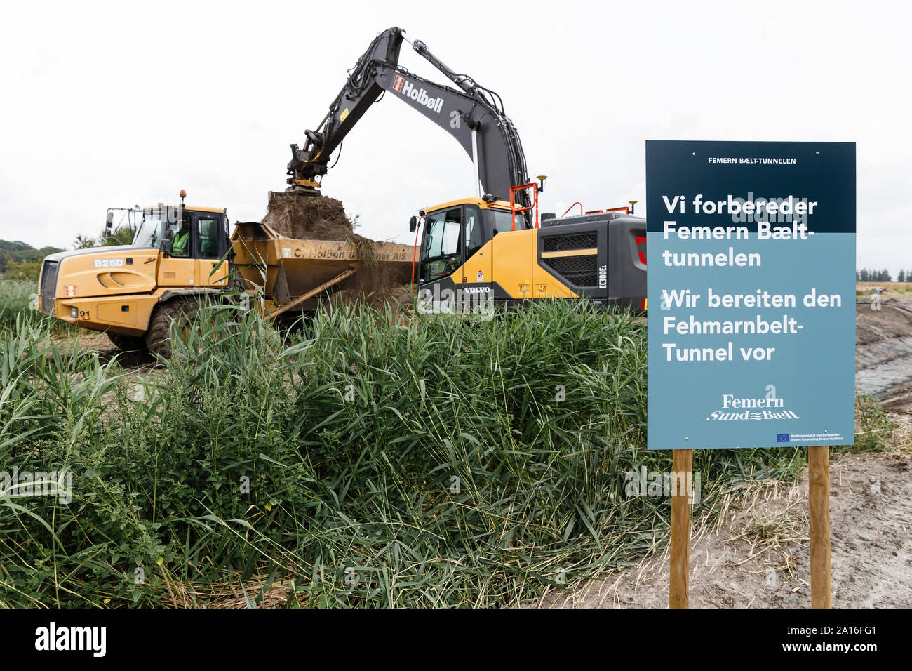 Denmark. 01st Aug, 2019. Construction machines dig a drainage ditch on ...
