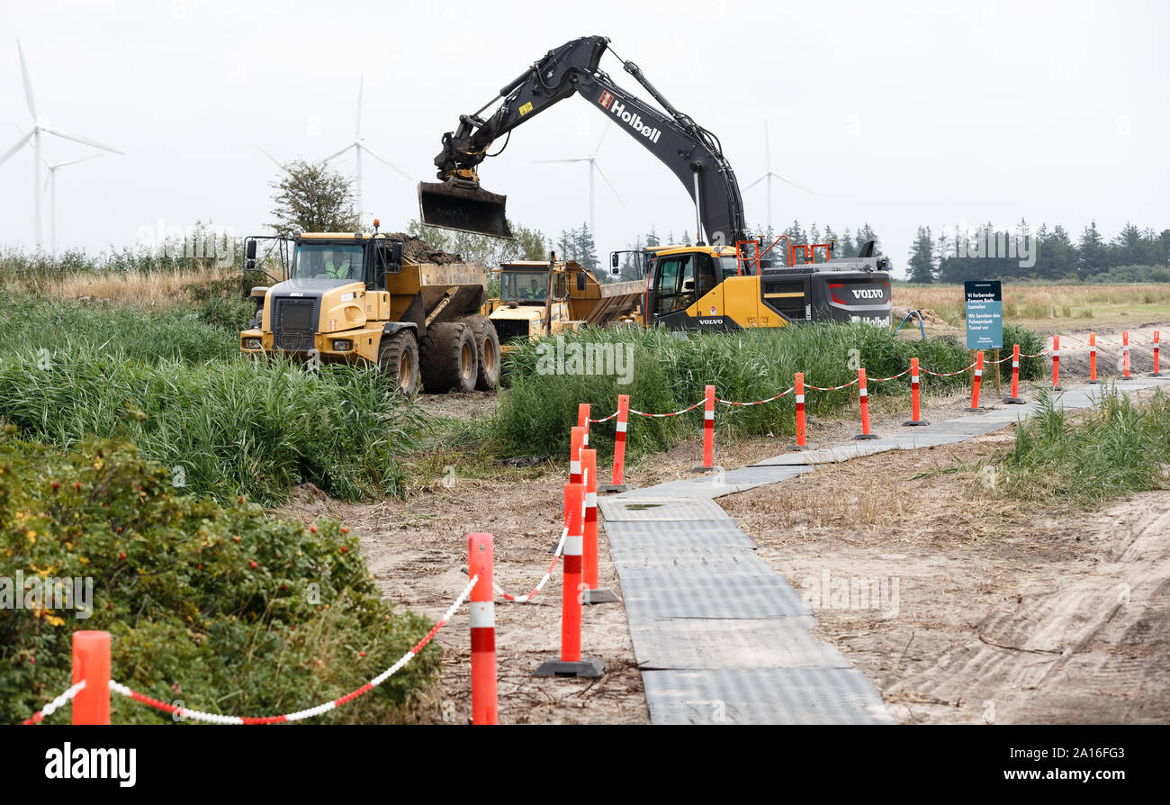 Denmark. 01st Aug, 2019. Construction machines dig a drainage ditch on ...