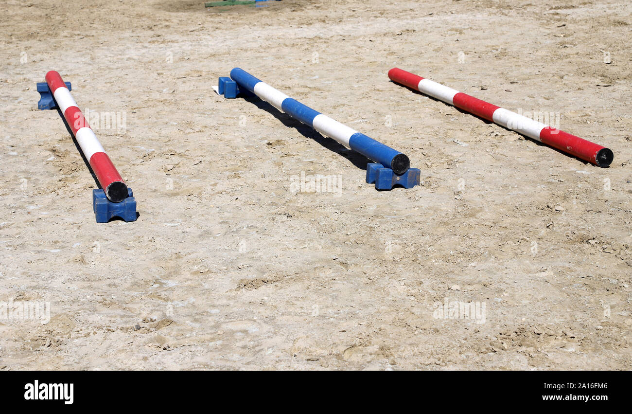 Obstacles for horses in a riding school.Various colorful obstacles for ...