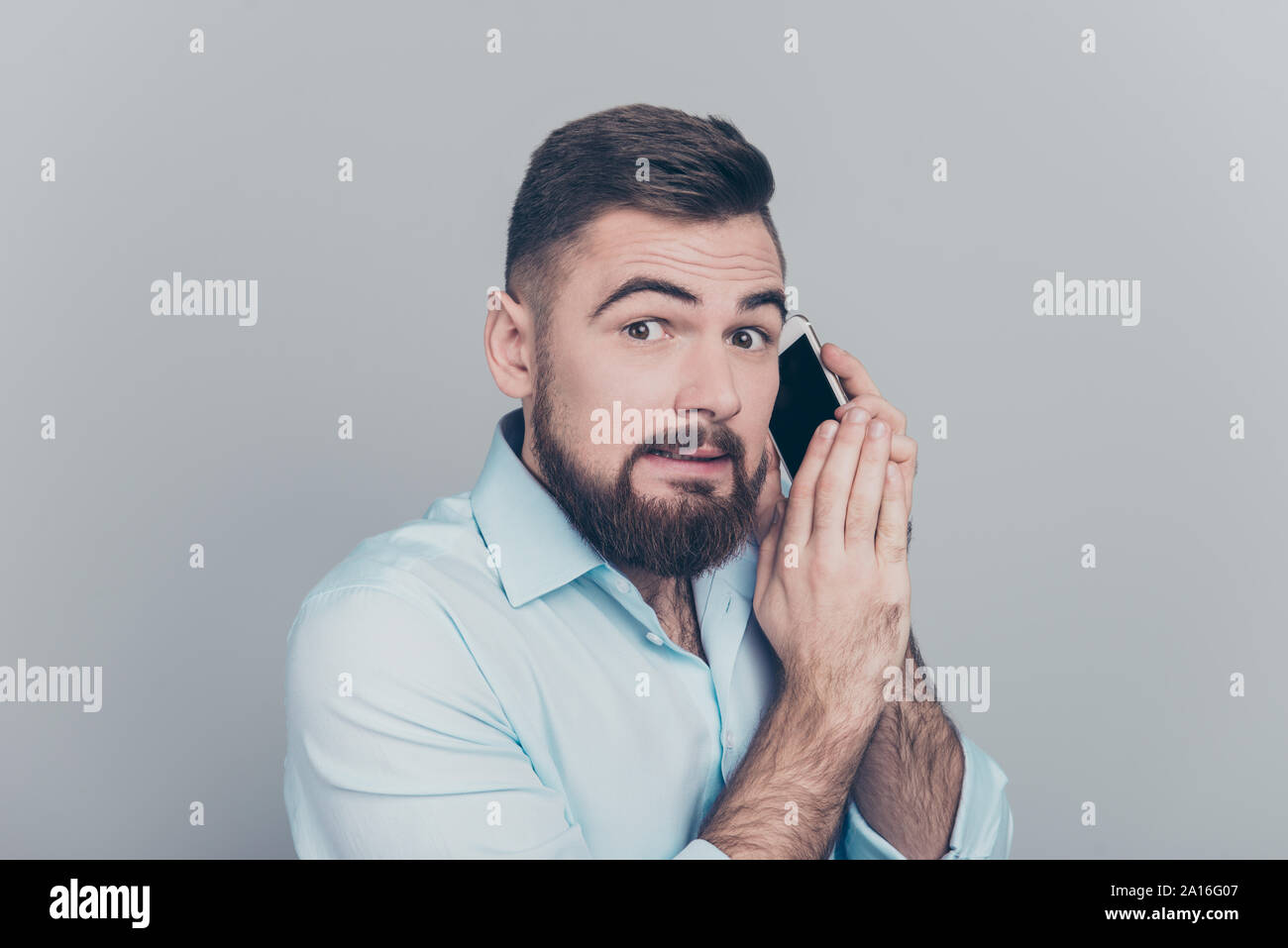 Close up photo portrait of busy noisy talking on telephone guy h Stock ...