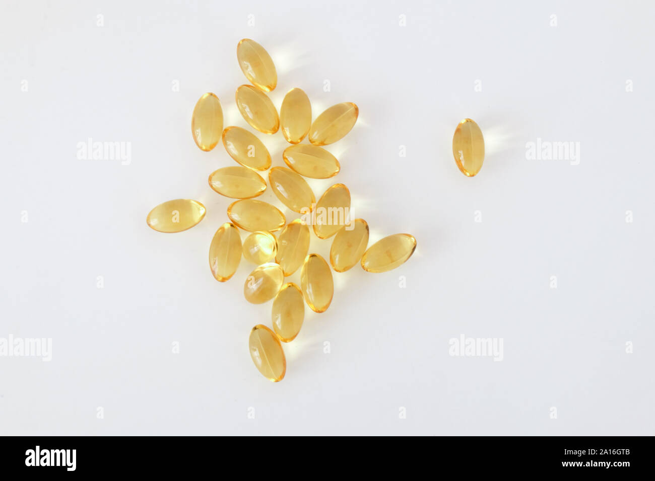 Yellow pills, omega 3, on white background Stock Photo - Alamy