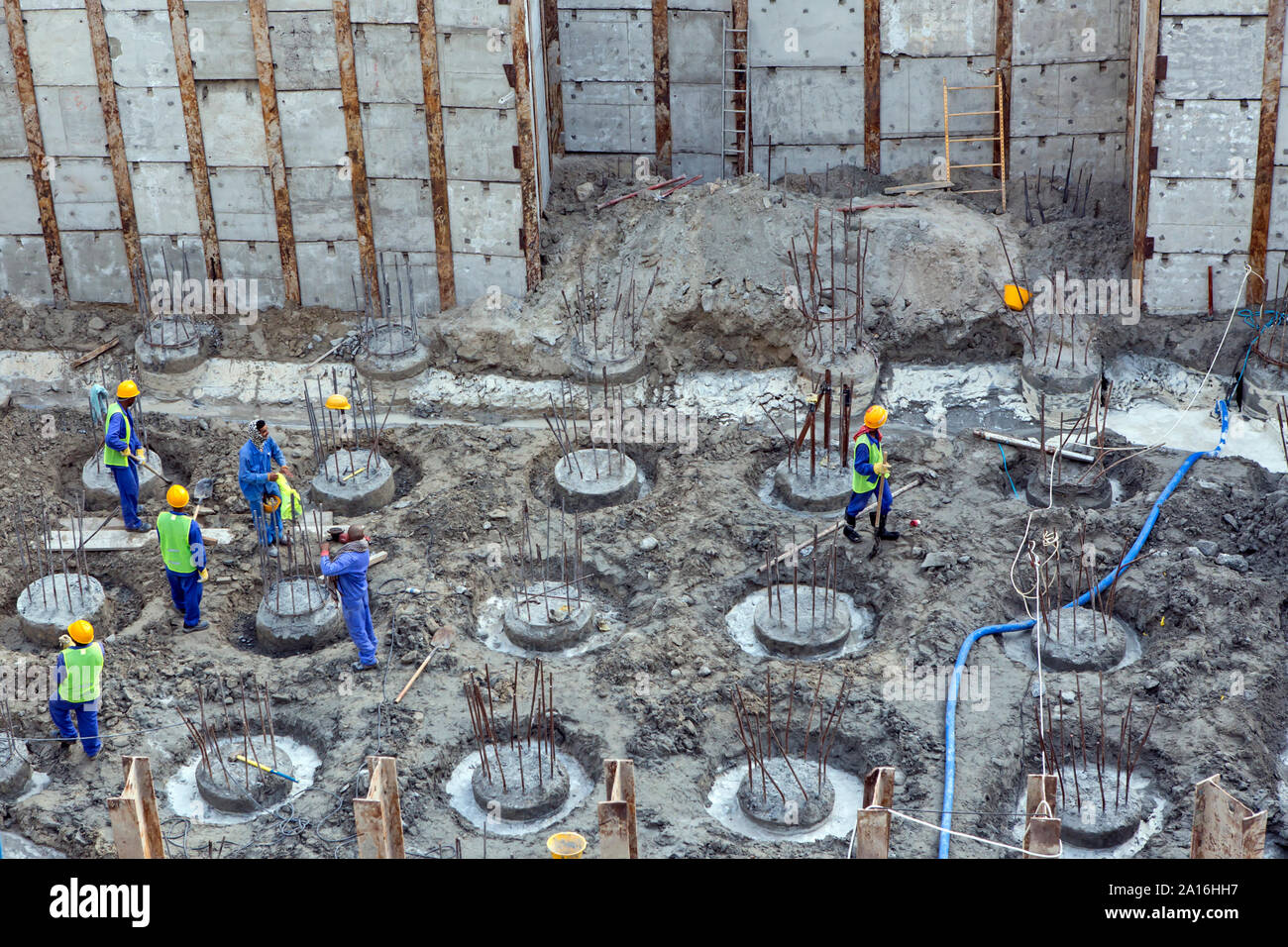 DUBAI - Construction workers on a building site in Dubai Marina Stock ...