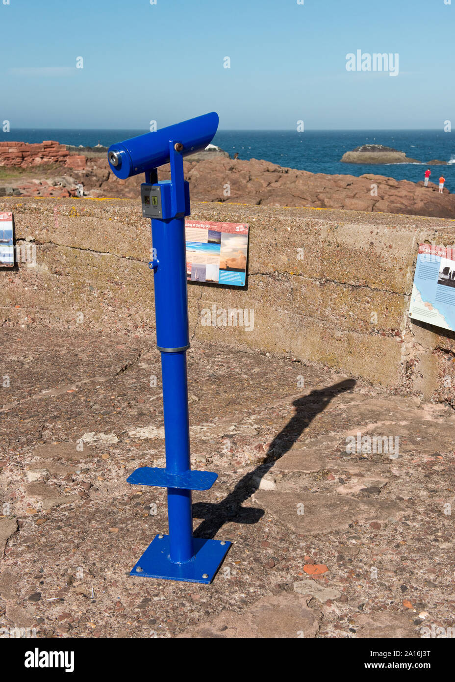 Coin-operated telescope on wall of Cromwell Harbour. Dunbar, Scotland ...