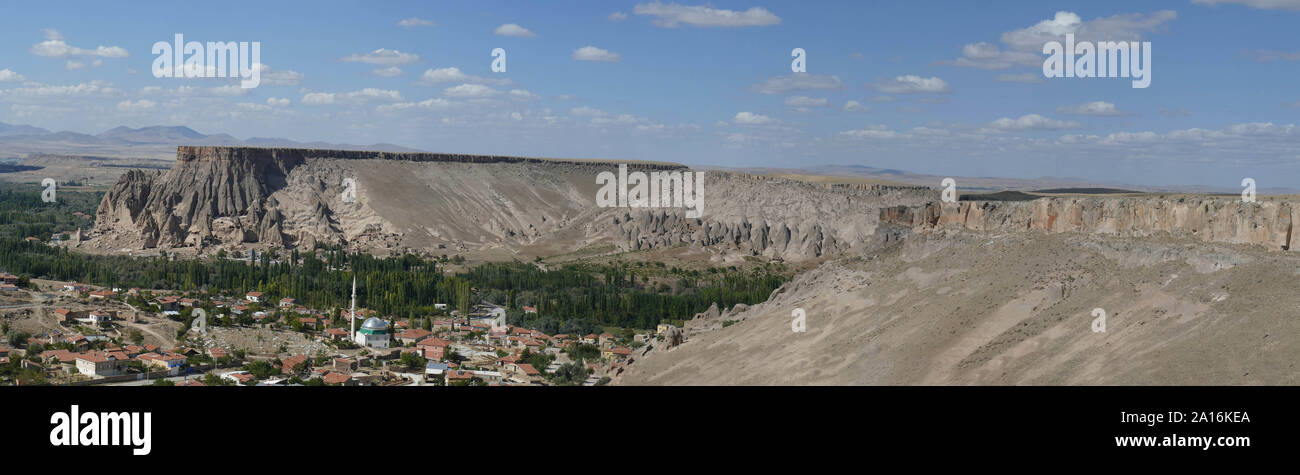 Tufa mesa and village with mosque in Cappadocia, Turkey Stock Photo - Alamy