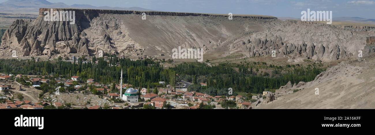 Tufa mesa and village with mosque in Cappadocia, Turkey Stock Photo - Alamy