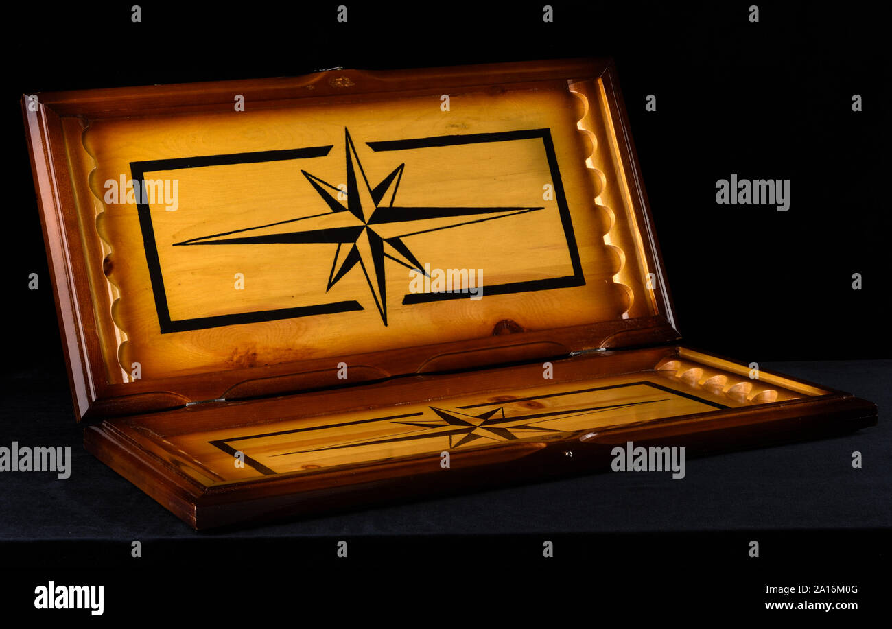 Open backgammon board over a dark background. A beautiful board for an ...