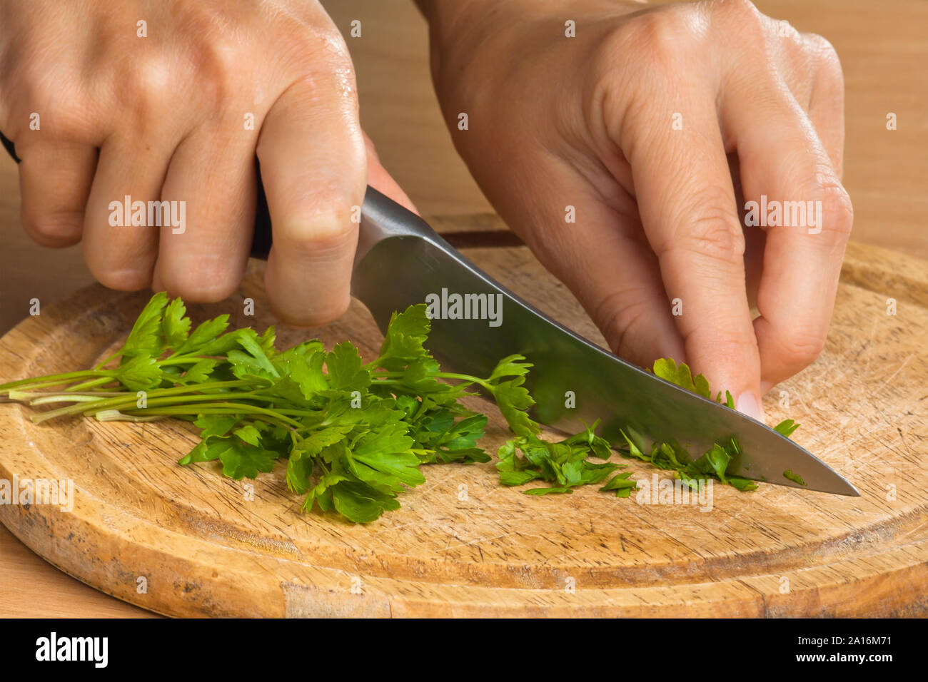 Organic woman chopping leaves hi-res stock photography and images - Alamy