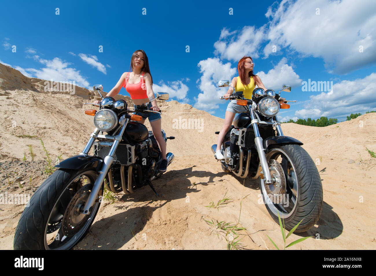 Two women riding on motorcycle hi-res stock photography and images - Alamy