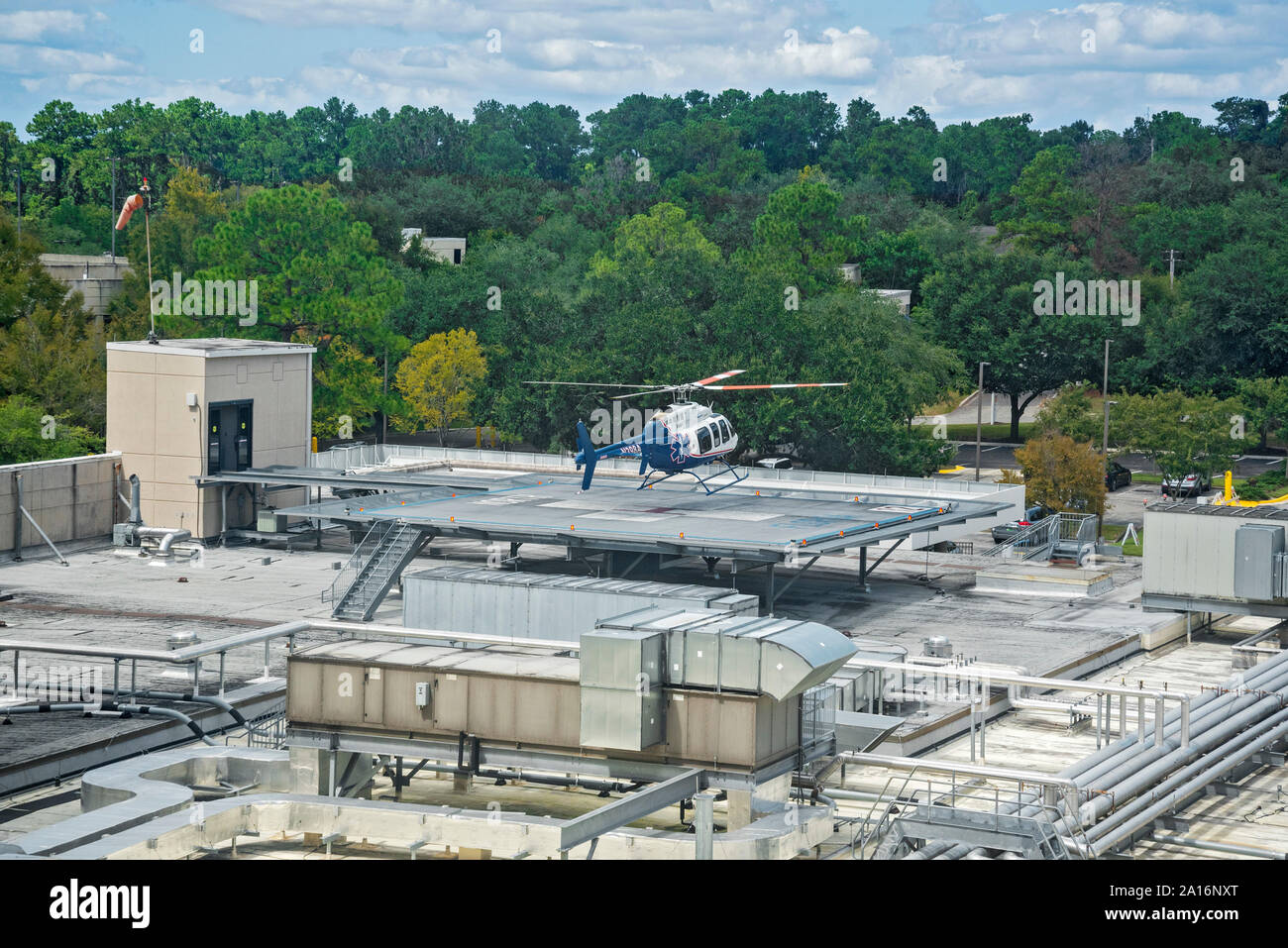 Emergency helicopter landing on a hospital rooftop helipad Stock Photo ...