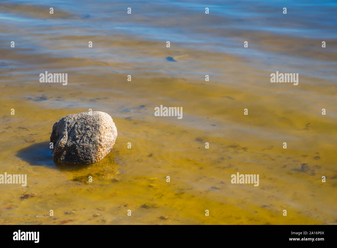 Lake shore and stone Stock Photo - Alamy