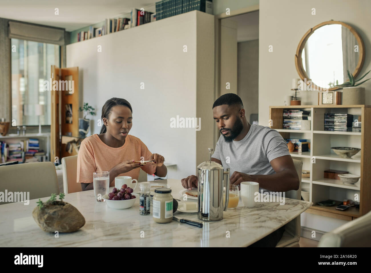 Couple having breakfast at dining table hi-res stock photography and ...