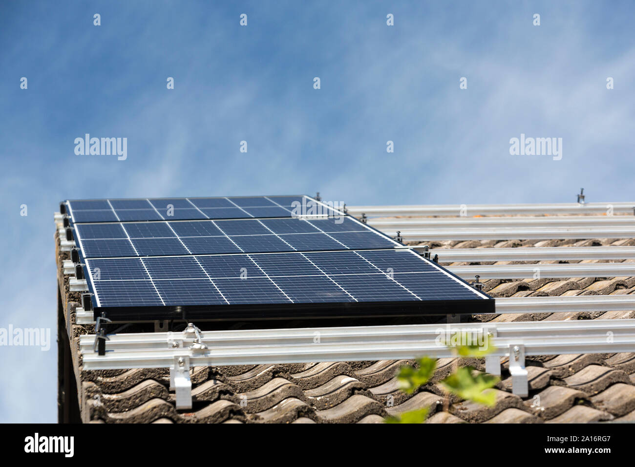 Installing solar photovoltaic panel system. Solar panel technician ...
