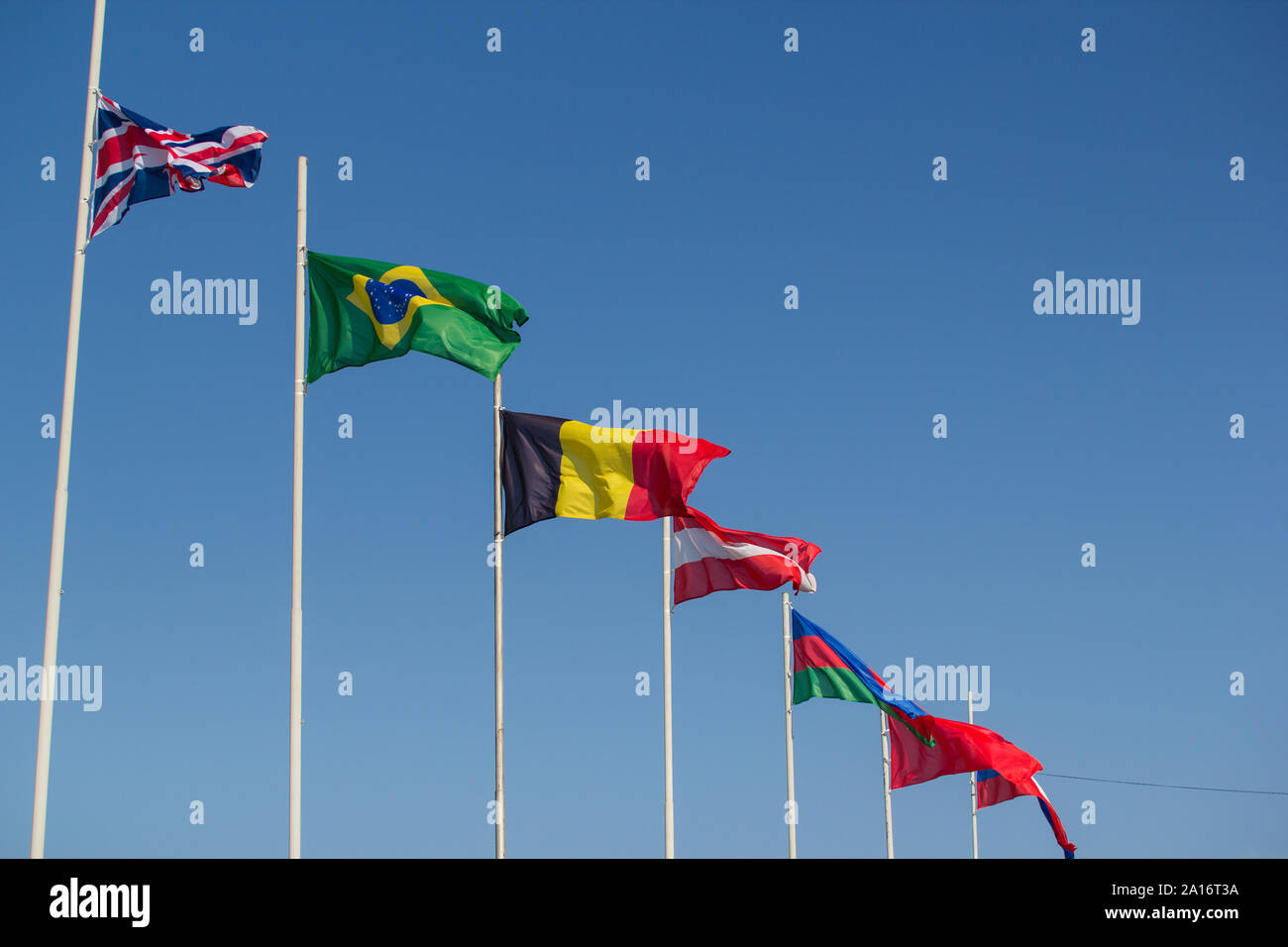 Flags of the world countries blowing in the wind on a background of the ...