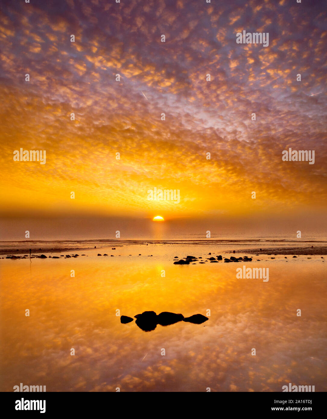 dawn over the beach Stock Photo - Alamy