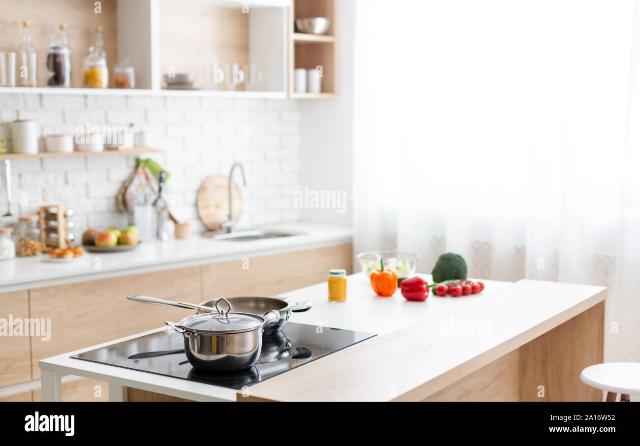 Modern kitchen interior at home with cooking dishes Stock Photo - Alamy
