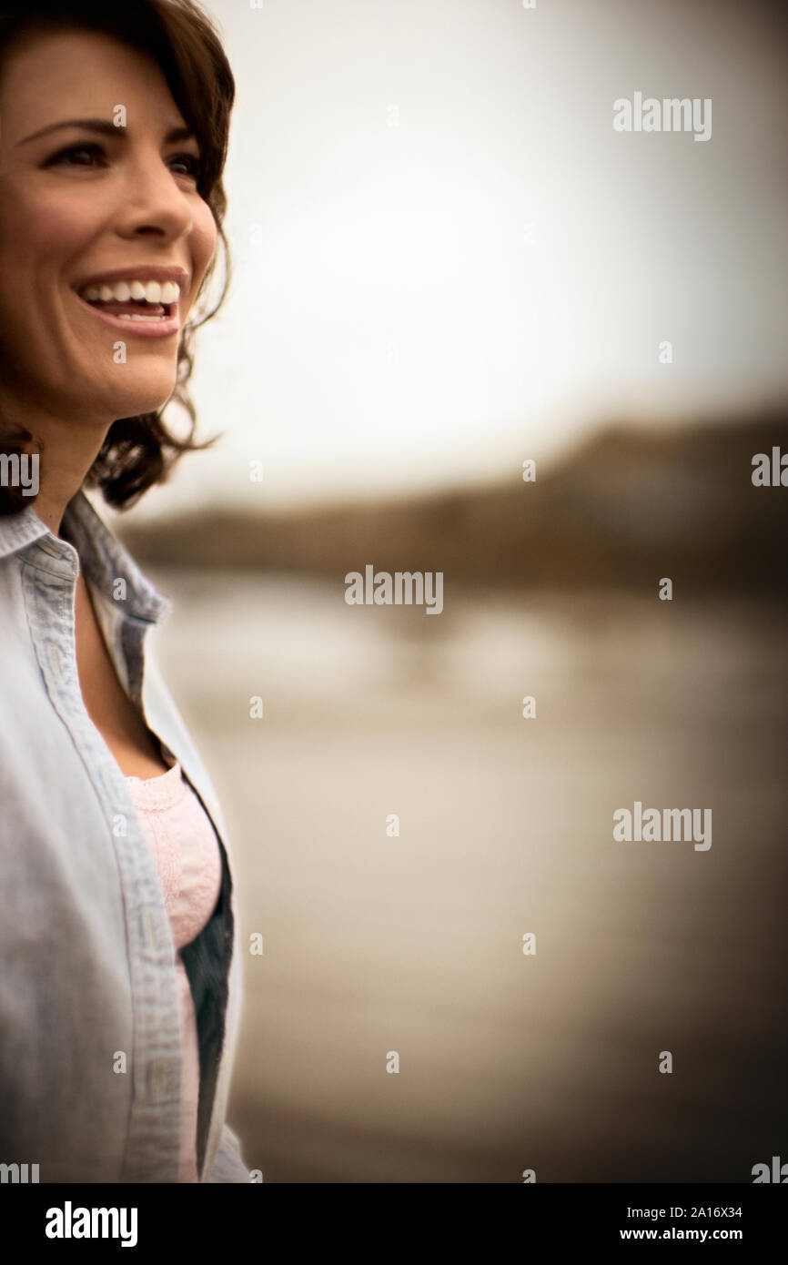 Side view of a woman laughing Stock Photo - Alamy