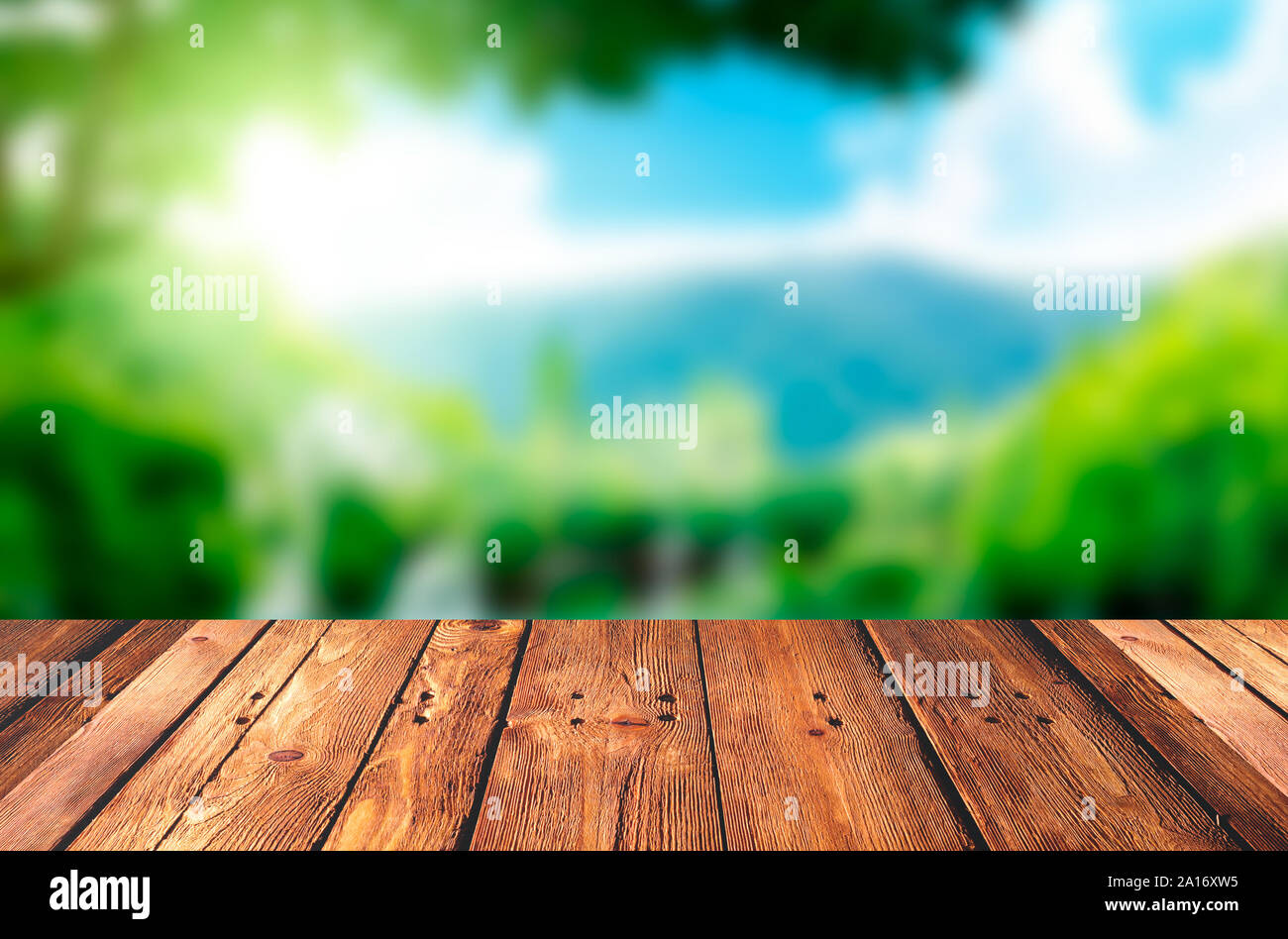 Wood Table with Blurred Nature Background Stock Photo - Alamy