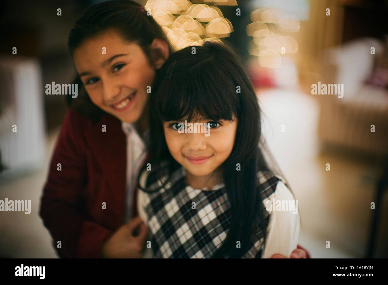 Two girls smiling at the camera Stock Photo - Alamy